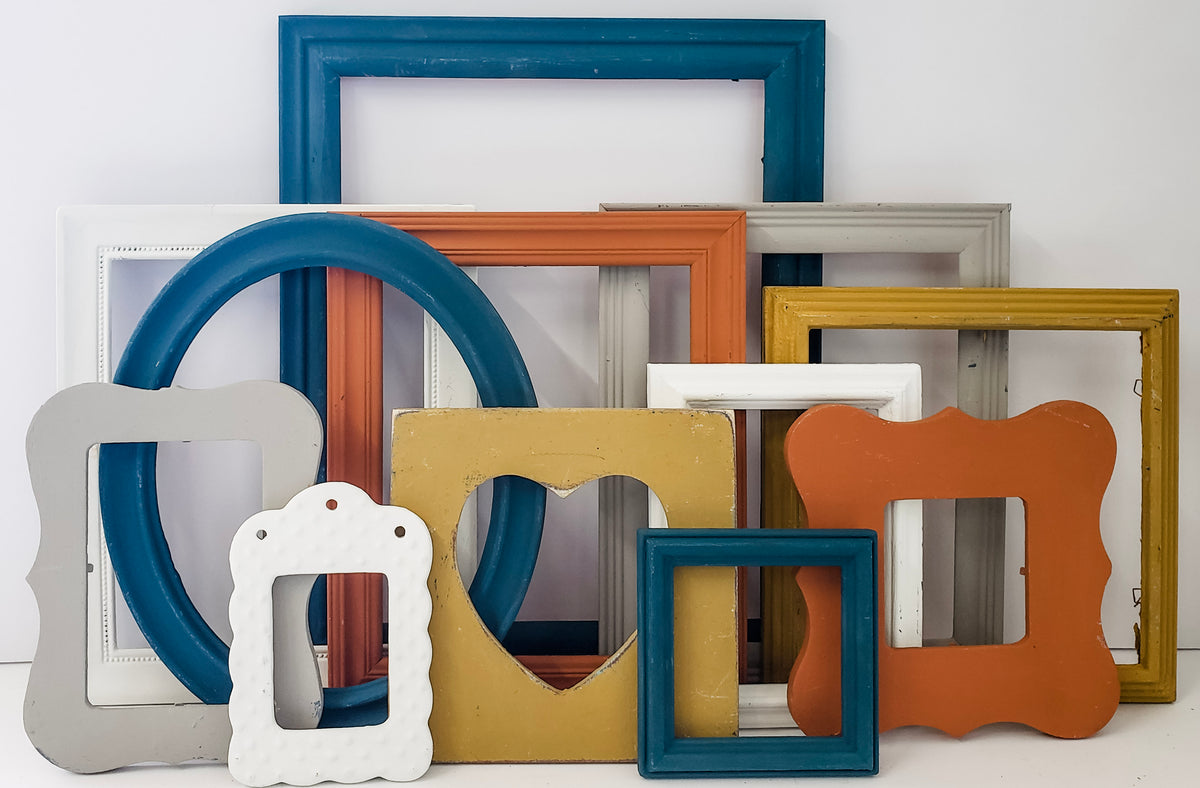 Color infused masterpiece of an eclectic gallery wall of picture frame ...